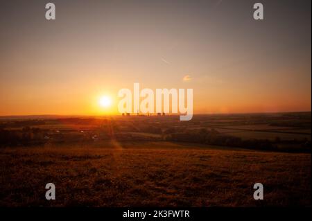 Sunset on Wittenham Clumps,with the old Didcot power station in the ...