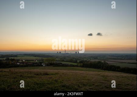 Sunset on Wittenham Clumps,with the old Didcot power station in the ...
