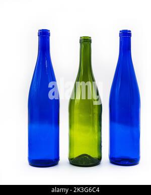 Three bottles of wine. dark blue and turquoise. isolated on white ...