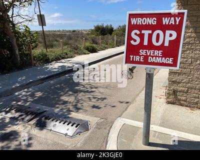 Wrong way stop severe tire damage sign Stock Photo - Alamy