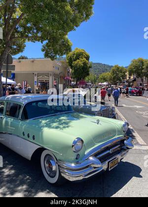 Colorful cars parked and displayed on the street during Classic and ...