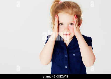 Oops.... Cropped portrait of an adorable little girl looking shocked ...