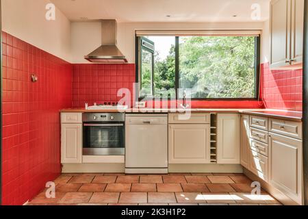 Hall near kitchen in spacious room of contemporary empty apartment ...