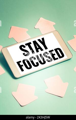 Sign displaying Stay Focused, Business idea Be attentive Concentrate ...