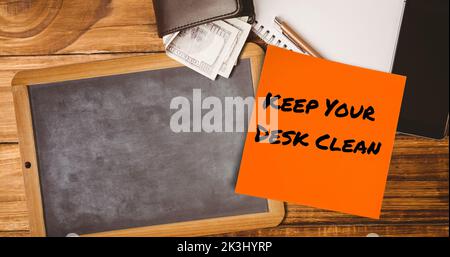 Composite of keep your desk clean on sticky note with cellphone and ...