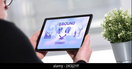 Tablet screen displaying a rebound concept Stock Photo - Alamy