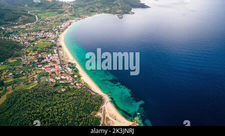 An aerial view of the coastal village and Toroni beach in Sithonia ...