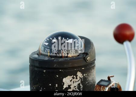boat control engine speed knob and compass Stock Photo - Alamy