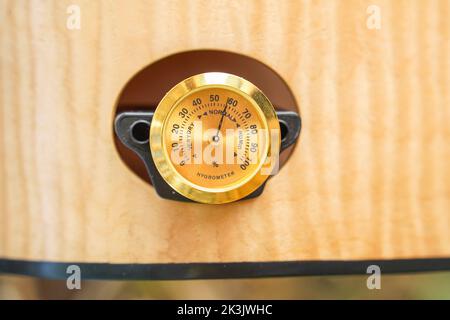 Guitar humidifier with hygrometer placed in a sound hole Stock Photo ...