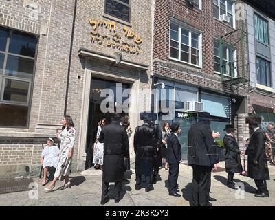 Orthodox Jewish men going to the synagogue on the sabbath in the Borogh ...