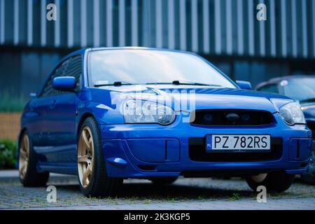 Blue Subaru Impreza WRX Blobeye with gold wheels and smoked taillights ...