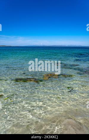 The azure waters of Kilmurvey beach, Inishmore, the largest of the Aran ...