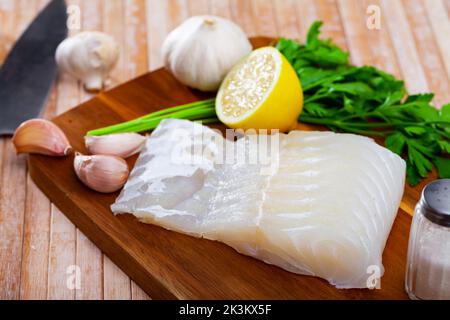 Raw pink cusk-eel fish fillet, seafood ingredients Stock Photo - Alamy