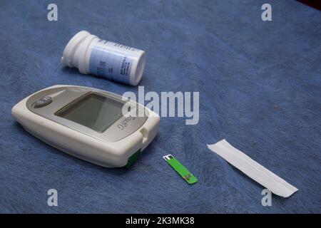 Glucometer on a blue medical cloth Stock Photo - Alamy