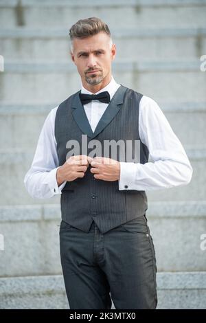 grizzle elegant man in bowtie. grizzled man in formalwear. tux man ...