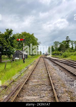 Old railroad track through countryside in autumn, aerial view from ...
