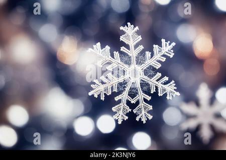 A closeup shot of a snowflake on the bokeh lights background Stock ...