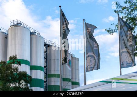 The building of the Eichbaum brewery with silos and flags produces a ...