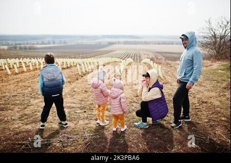 Family stand against vineyard in early spring Stock Photo - Alamy