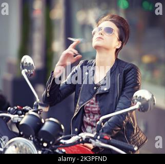 Punk rocker smoking cigarette Stock Photo - Alamy