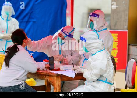 WEINING, CHINA - SEPTEMBER 28, 2022 - A baby gets nucleic acid tests in ...