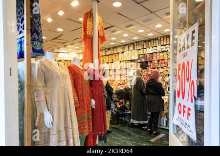 Interior of Indian Asian clothing mall and shops with saris and dresses ...