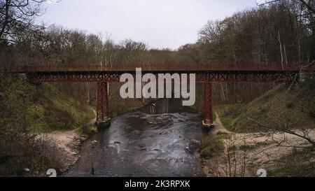 red steel bridge in denmark Stock Photo - Alamy