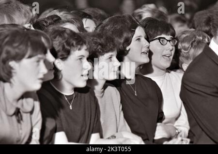 TEENAGERS at the Royal, Tottenham, London, in January 1964 watching the ...
