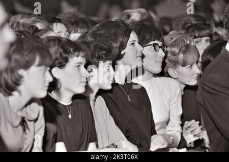 TEENAGERS at the Royal, Tottenham, London, in January 1964 watching the ...