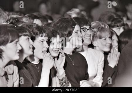 TEENAGERS at the Royal, Tottenham, London, in January 1964 watching the ...
