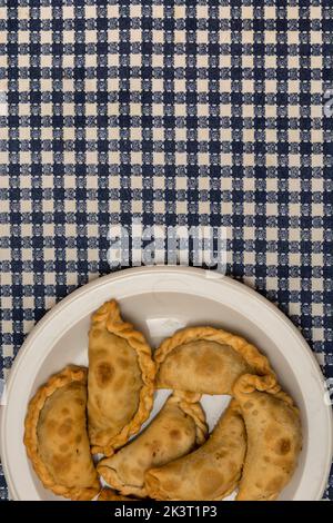 Argentine meat pie,presented on a plate on the table,Argentine ...