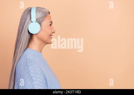 Photo of adorable charming retired woman blue sweater smiling isolated ...