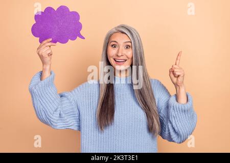 Photo of excited funny girl dressed ugly print pullover cap holding ...