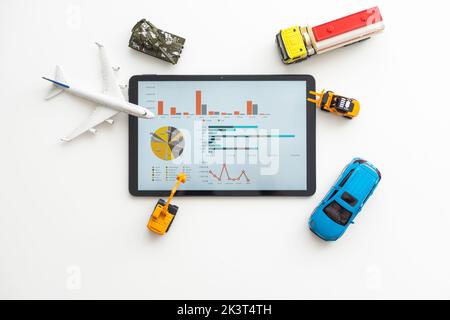 Tablet computer with different types of toy transport Stock Photo - Alamy