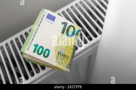 Euro banknotes on a heated radiator Stock Photo - Alamy