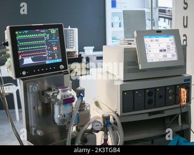 Modern equipment with vital signs monitors located in operating theater ...