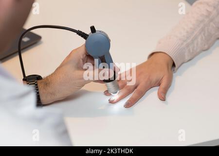 Systemic sclerosis diagnosis concept, hands of a doctor and a patient ...