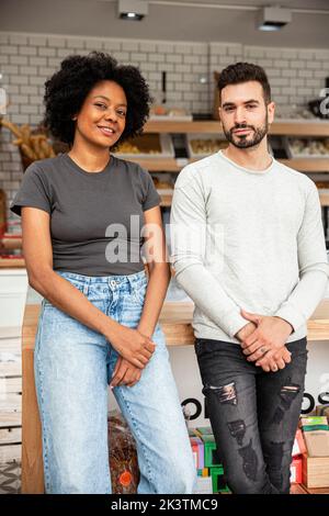 two bakers at the counter at bakery Stock Photo - Alamy