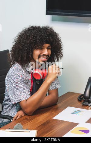 Hispanic man with curly hair working at pharmacy drugstore asking to be ...