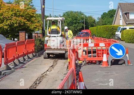 Street scene road works machines workmen & work in progress on ...