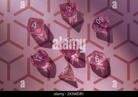 Overhead image of a set of a set of RPG dice on a leather-bound book ...