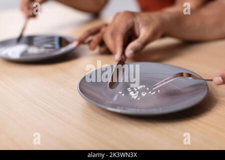 grains of black rice on wooden background Stock Photo - Alamy