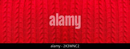 Red knitwear fabric texture with pigtails. Christmas red knitted ...