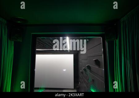 The interior of a private cinema booth in a public cinema. Comfortable ...