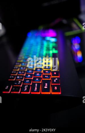 Modern computer and RGB keyboard on wooden table indoors Stock Photo ...