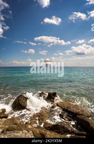 Waves against cloudy sky during sunset Stock Photo - Alamy