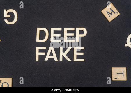 DEEP FAKE word written on dark paper background. DEEP FAKE text on dark ...