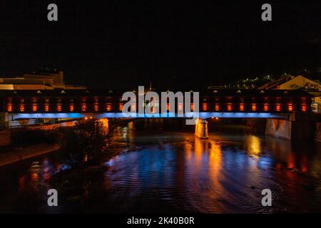 The colorful covered bridge in Lovech, Bulgaria at night. The bridge is ...