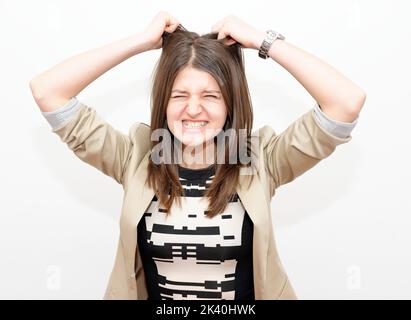 Stressed businesswoman ruffles her hair stock photo Stock Photo - Alamy