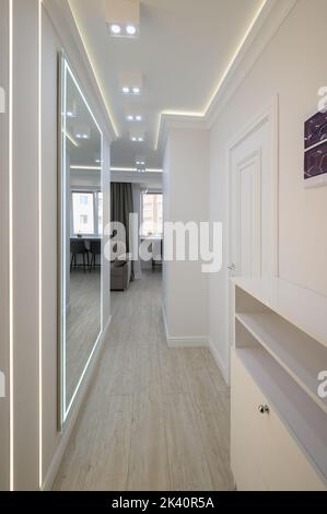 Interior design of narrow hallway with white gray walls Stock Photo - Alamy